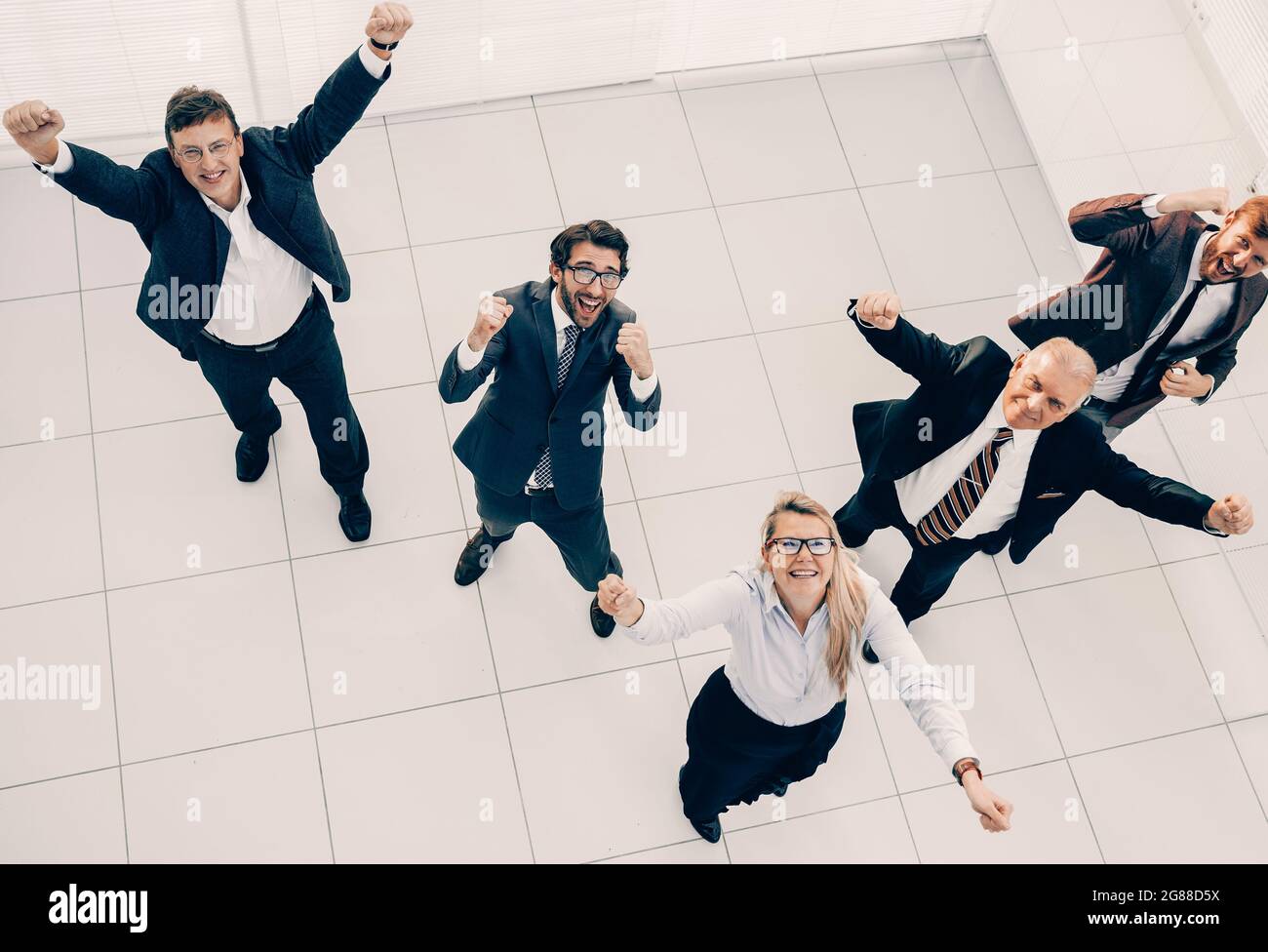 top view. group of happy people showing their success Stock Photo - Alamy