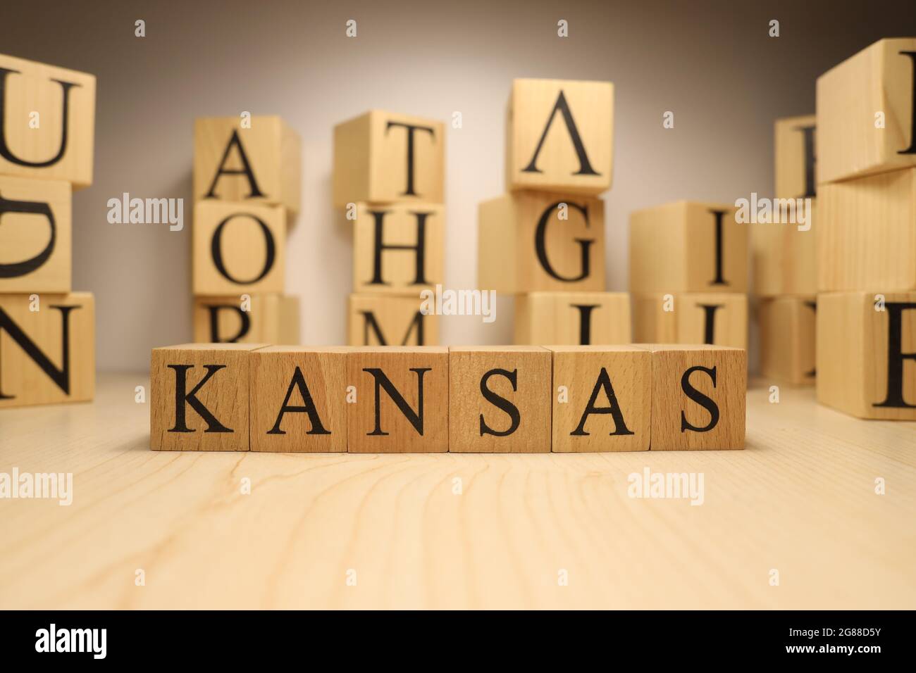 The word Kansas was created from wooden letter cubes. Cities and words ...