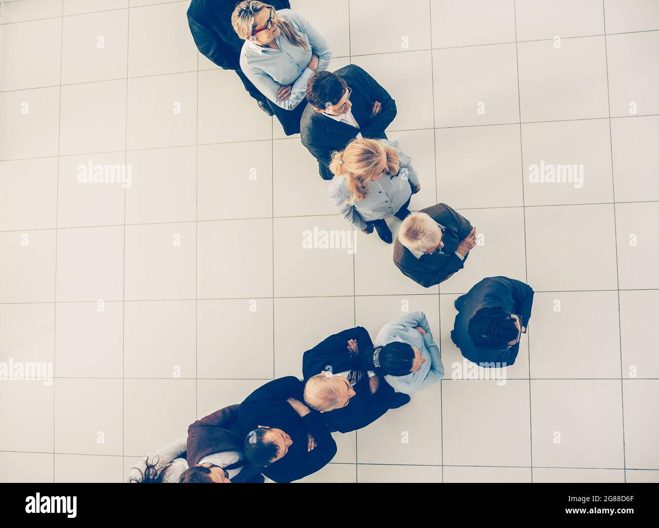 top view. business leader standing ahead of his colleagues Stock Photo ...