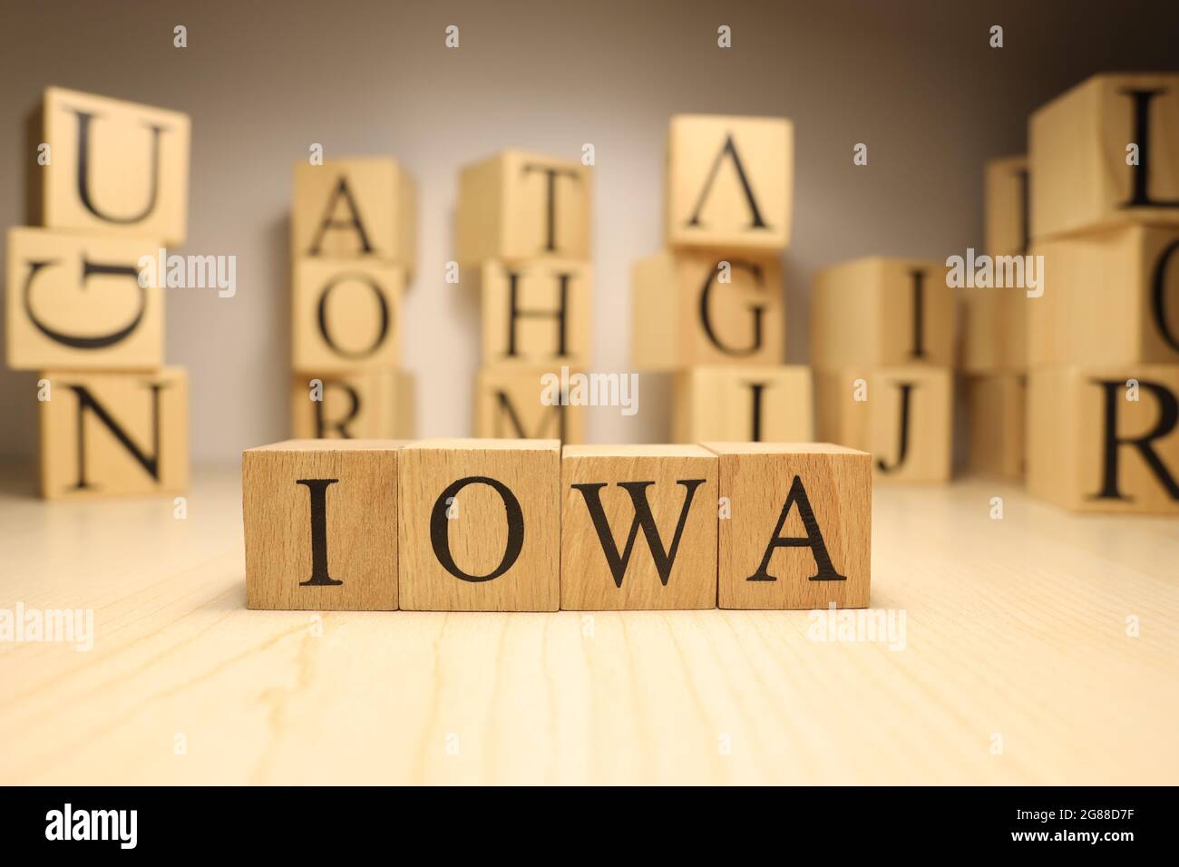 The word Iowa was created from wooden letter cubes. Cities and words ...