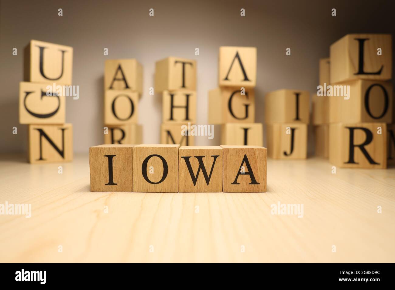 The word Iowa was created from wooden letter cubes. Cities and words ...