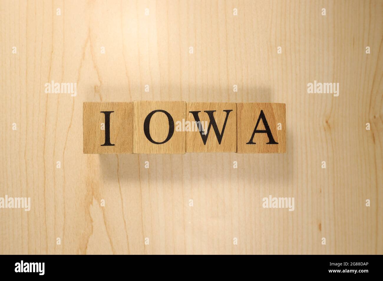 The word Iowa was created from wooden letter cubes. Cities and words ...