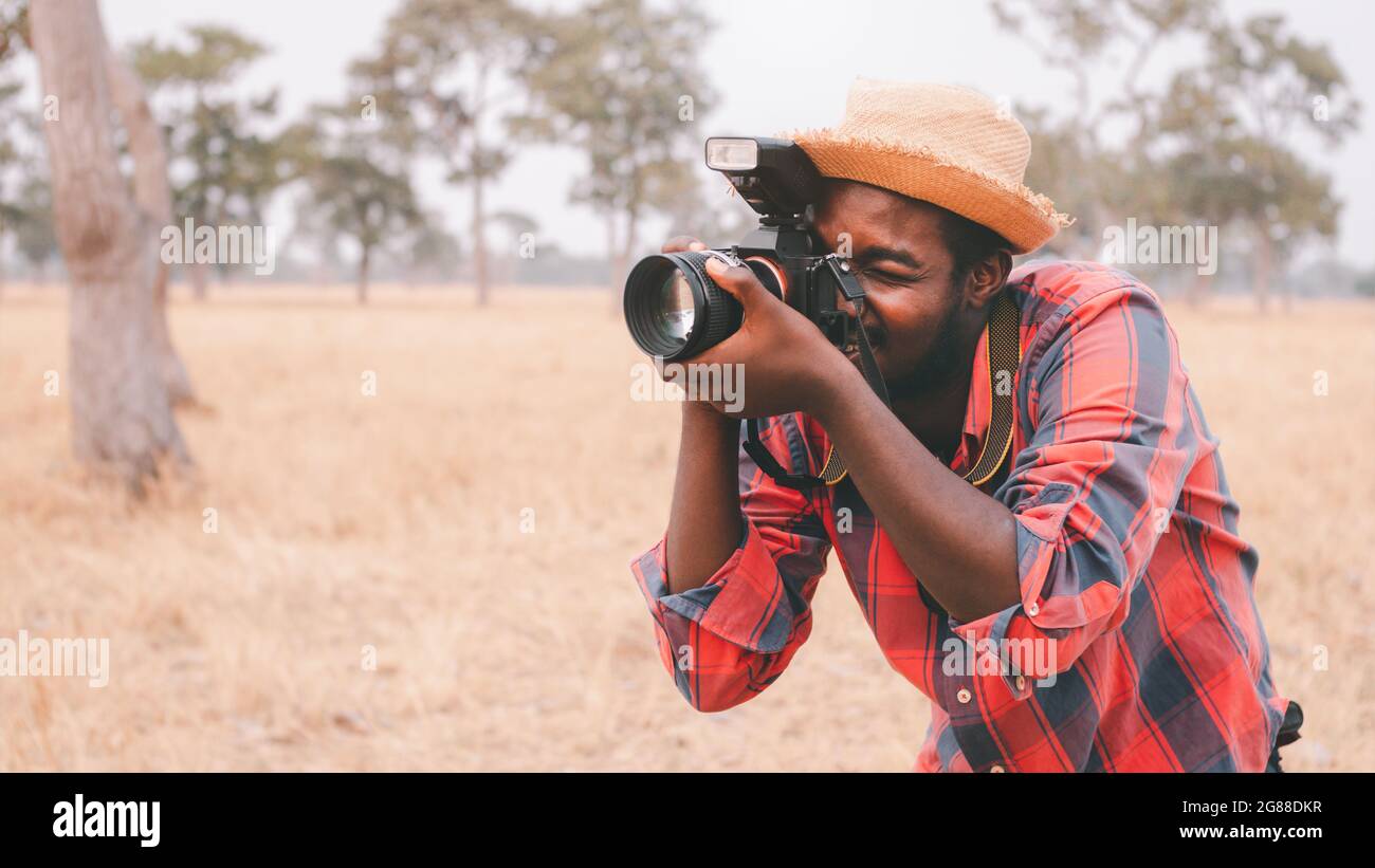 African Traveler man or photographers standing and traveling in the ...