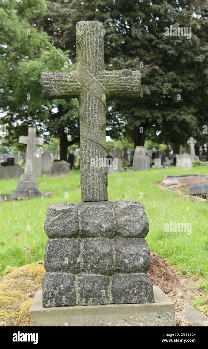 A Stone Cemetery Cross on a Plinth in a Graveyard Stock Photo - Alamy
