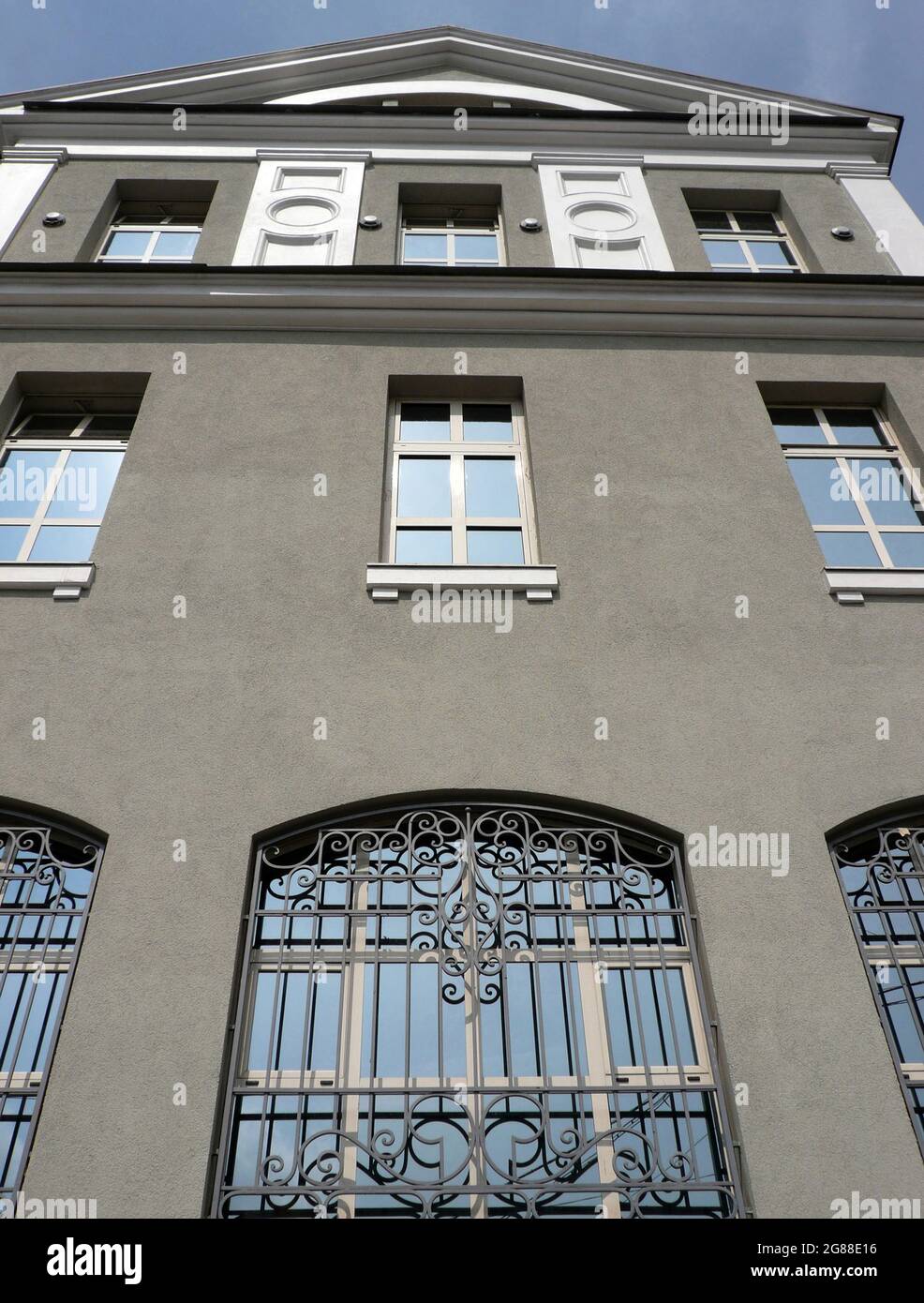 windows of building with grid at sunny day Stock Photo - Alamy
