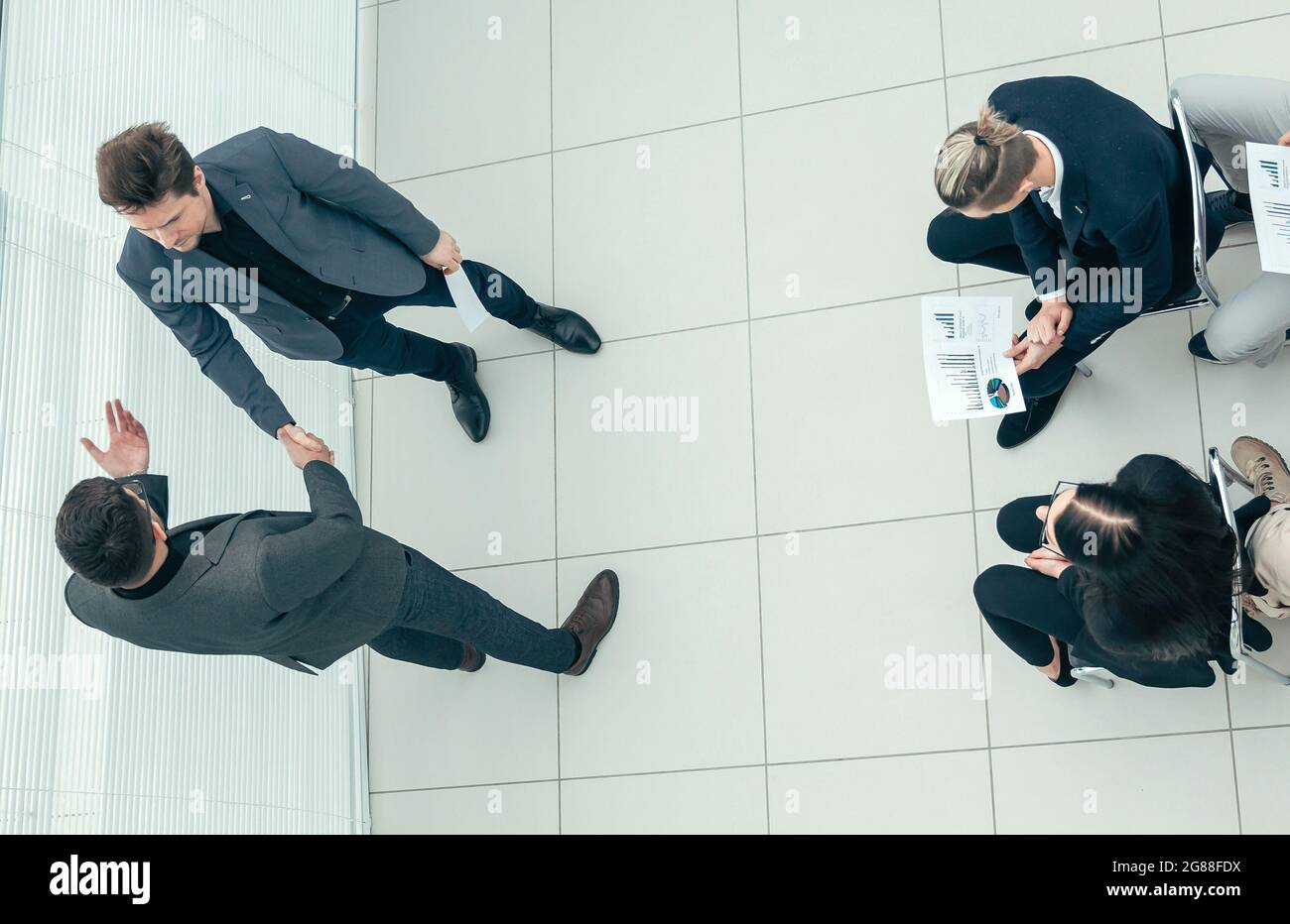 boss congratulates the employee on a good job Stock Photo - Alamy
