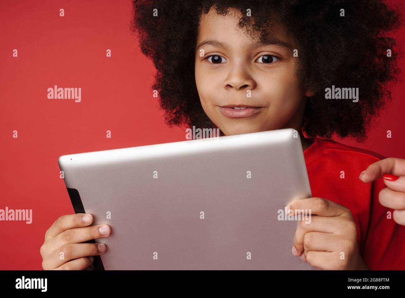 Kid holding tablet hi-res stock photography and images - Alamy