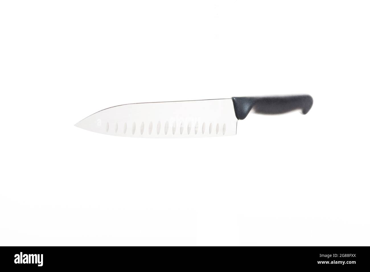Insulated kitchen knife at an angle. Large chef's knife at an angle ...