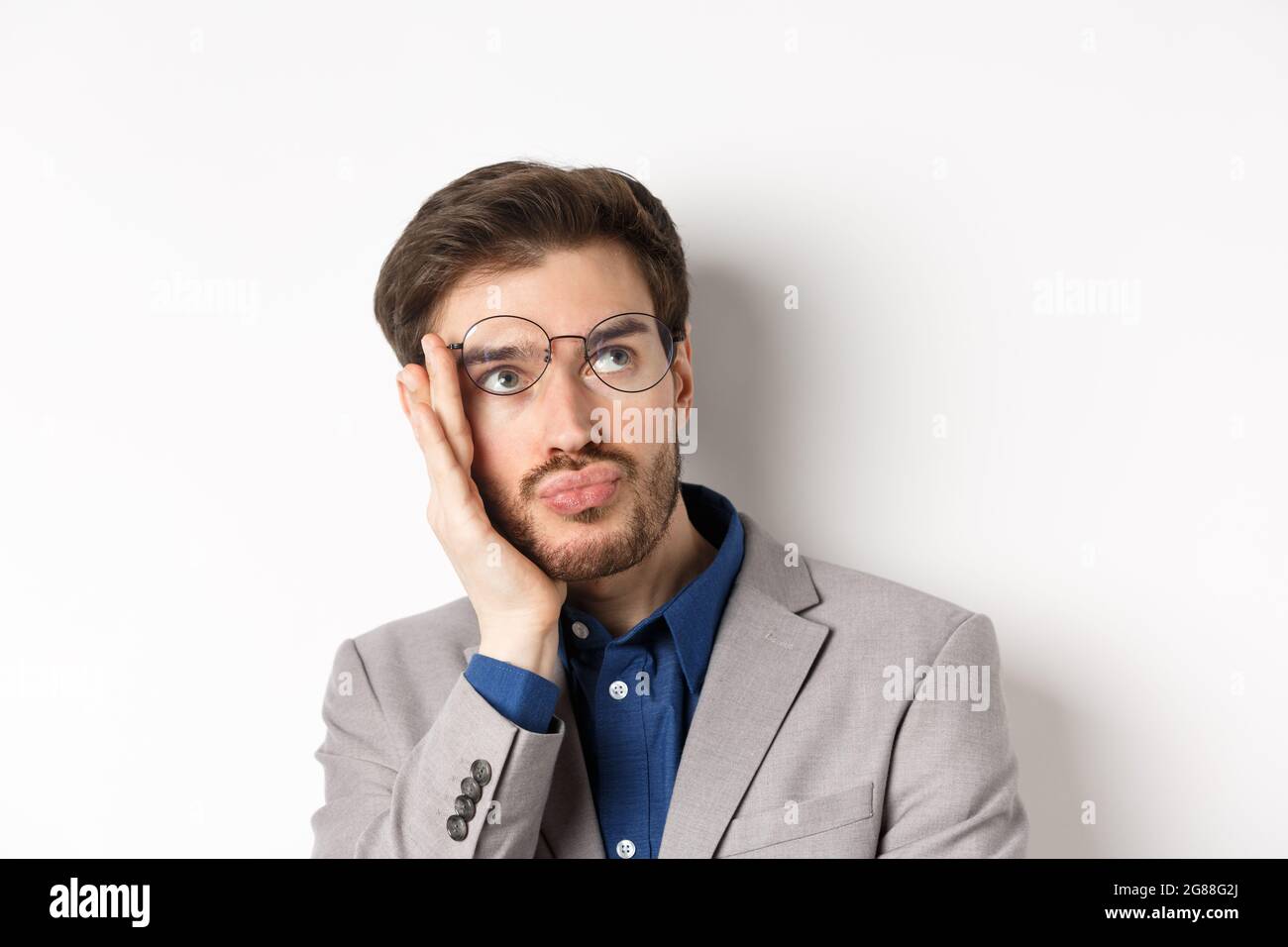 Close-up of shocked tired office worker takes-off glasses and stare at ...