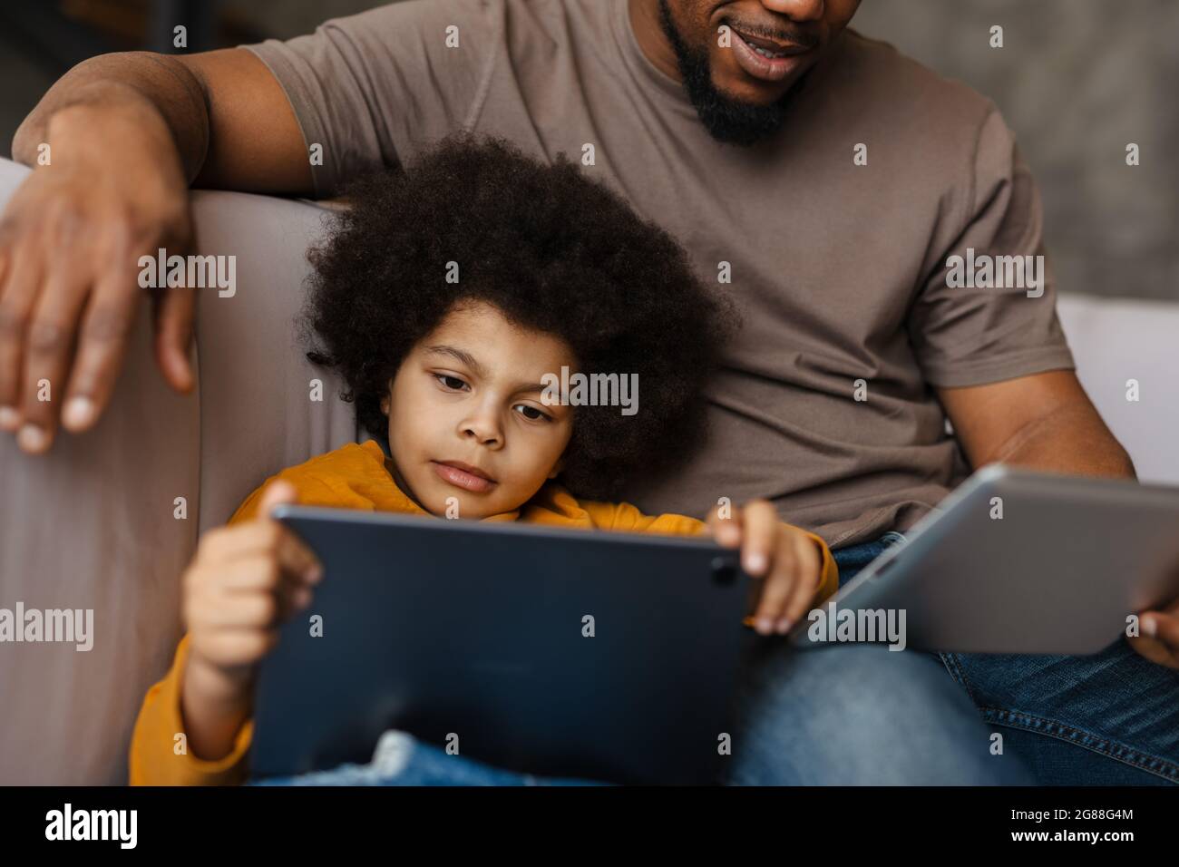 Father and son with computers hi-res stock photography and images - Alamy