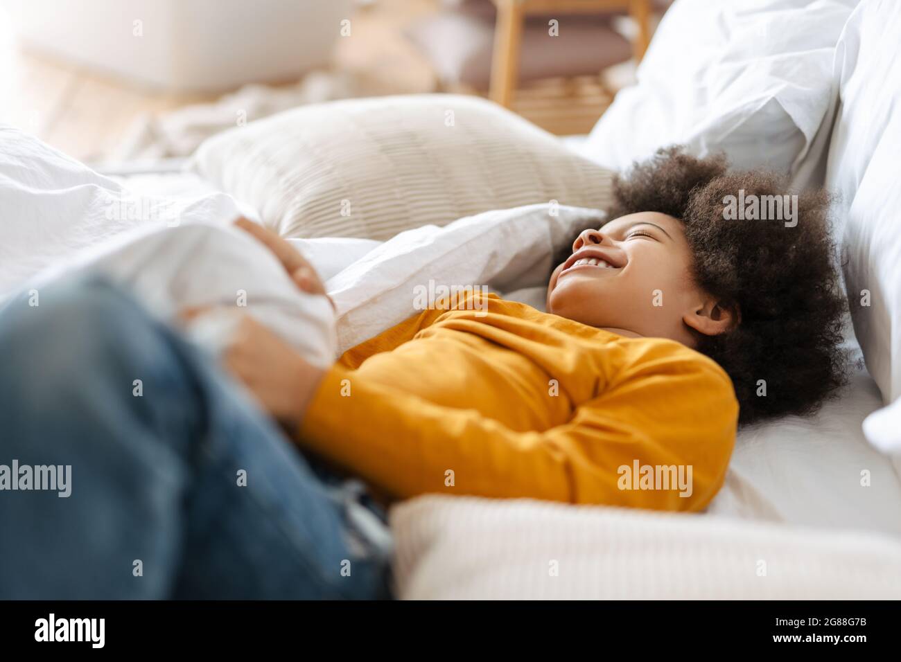 Boy making bed hi-res stock photography and images - Alamy