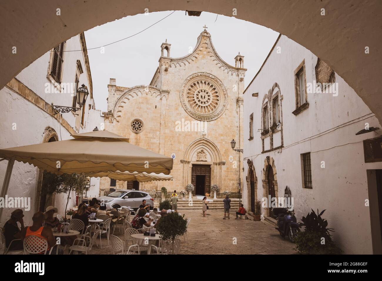 Cathedral of Saint Mary of the Assumption with a square and cafe full ...