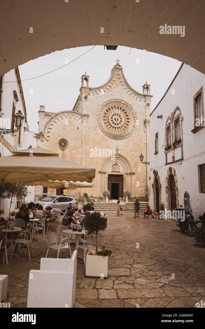 Cathedral of Saint Mary of the Assumption with a square and cafe full ...