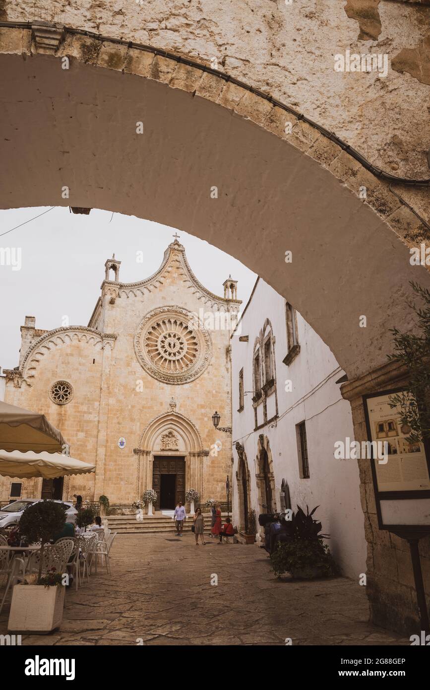 Cathedral of Saint Mary of the Assumption with a square and cafe full ...