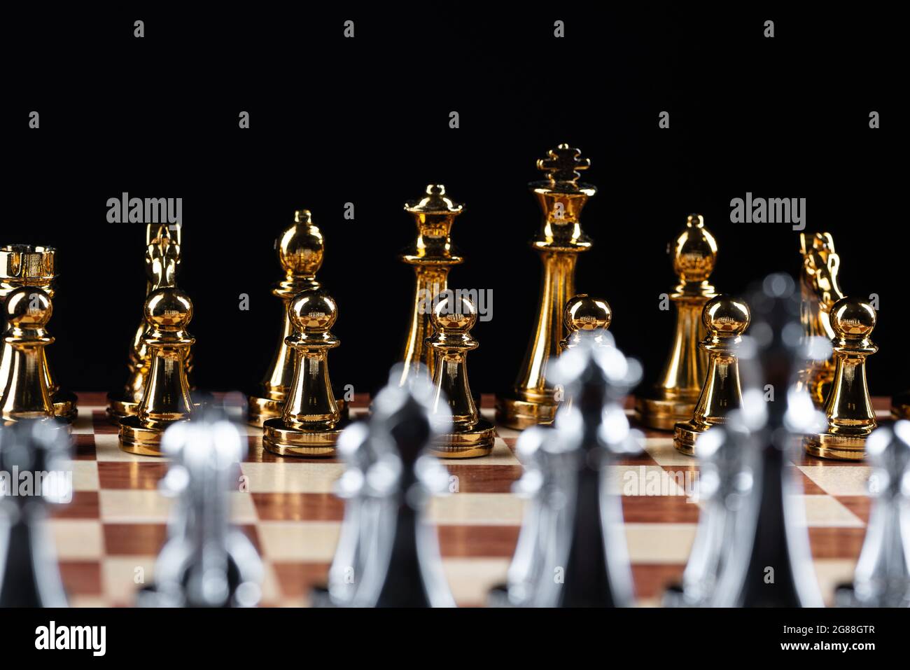 Gold and silver chess figures on chessboard Stock Photo - Alamy