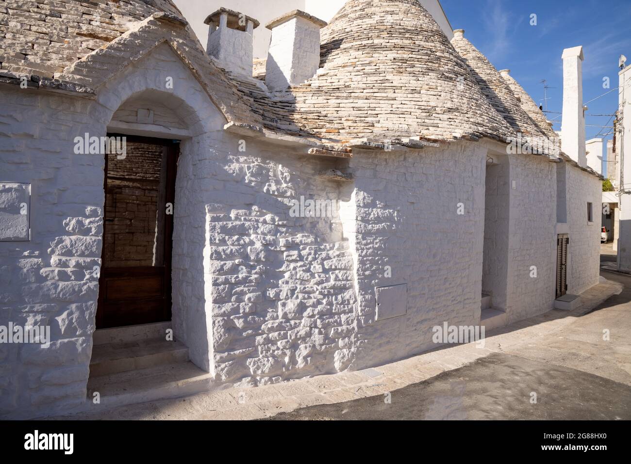 Beautiful town of Alberobello with typical trulli houses built from ...