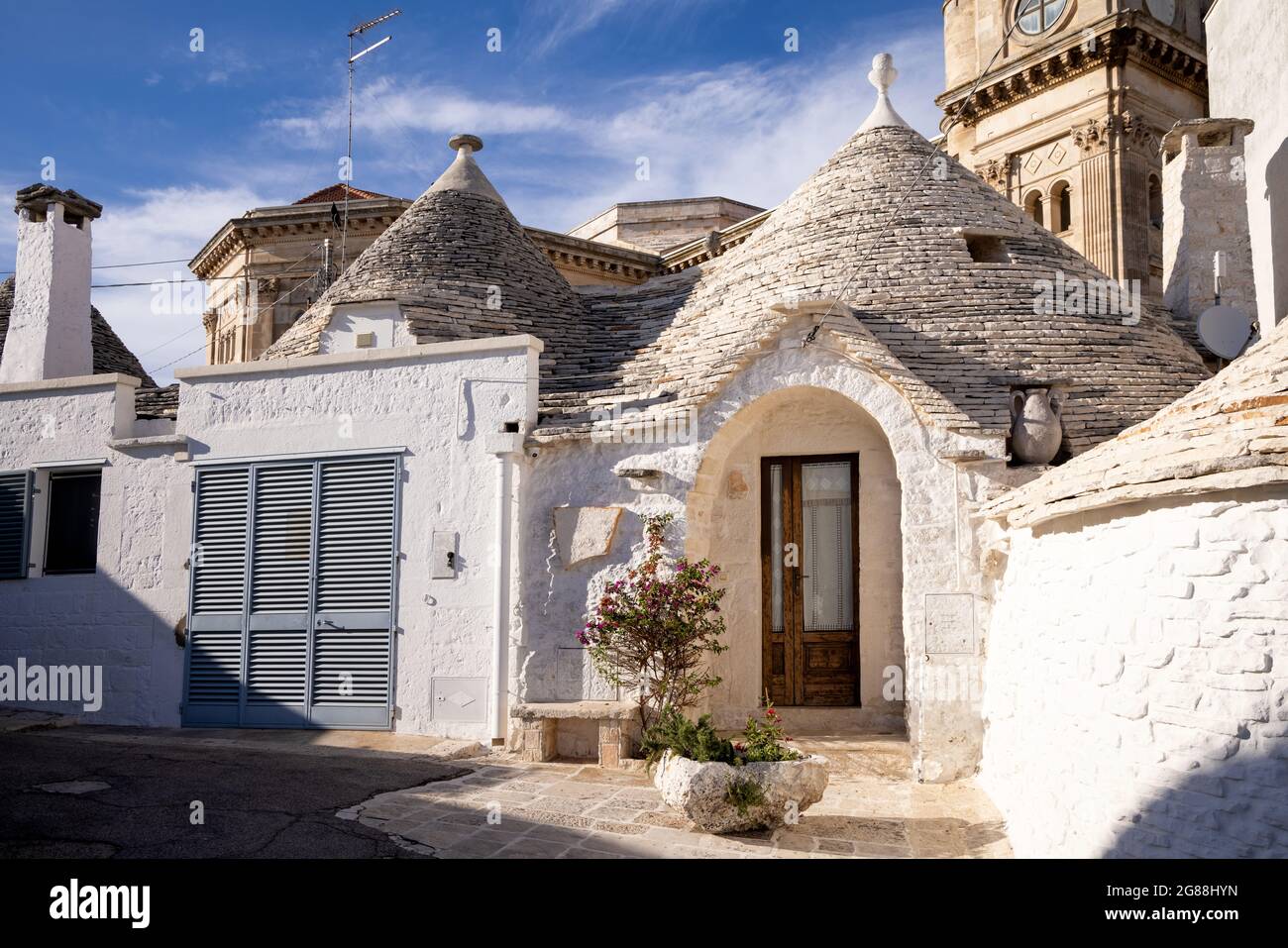 Beautiful town of Alberobello with typical trulli houses built from ...