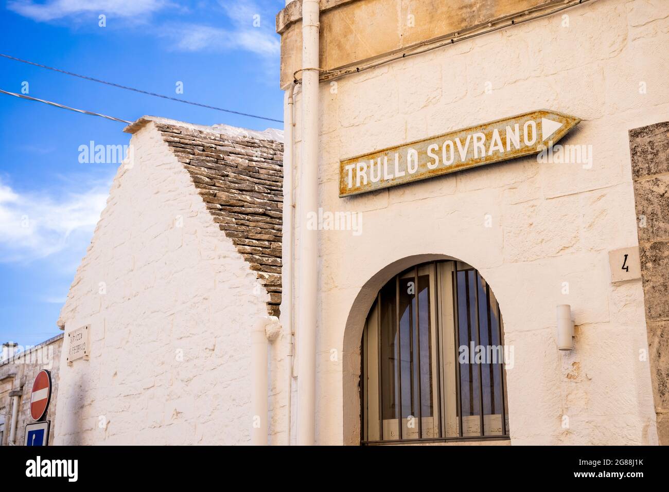 Arrow sign to the Trullo Sovrano. The Trullo Sovrano is two-story ...