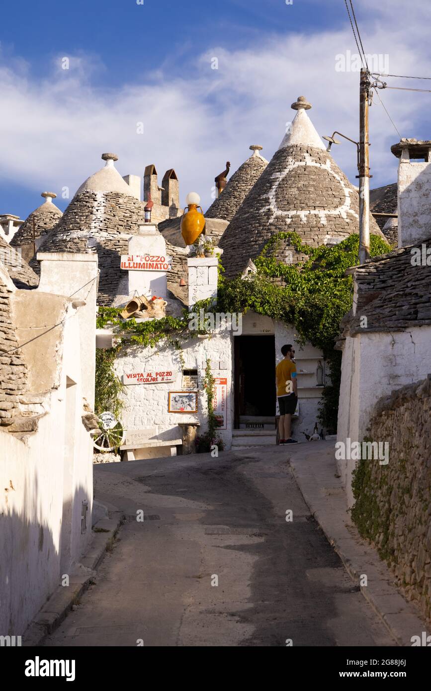 Beautiful town of Alberobello with typical trulli houses built from ...