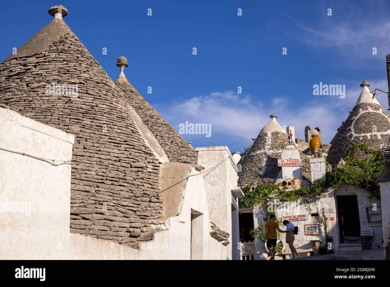 Beautiful town of Alberobello with typical trulli houses built from ...