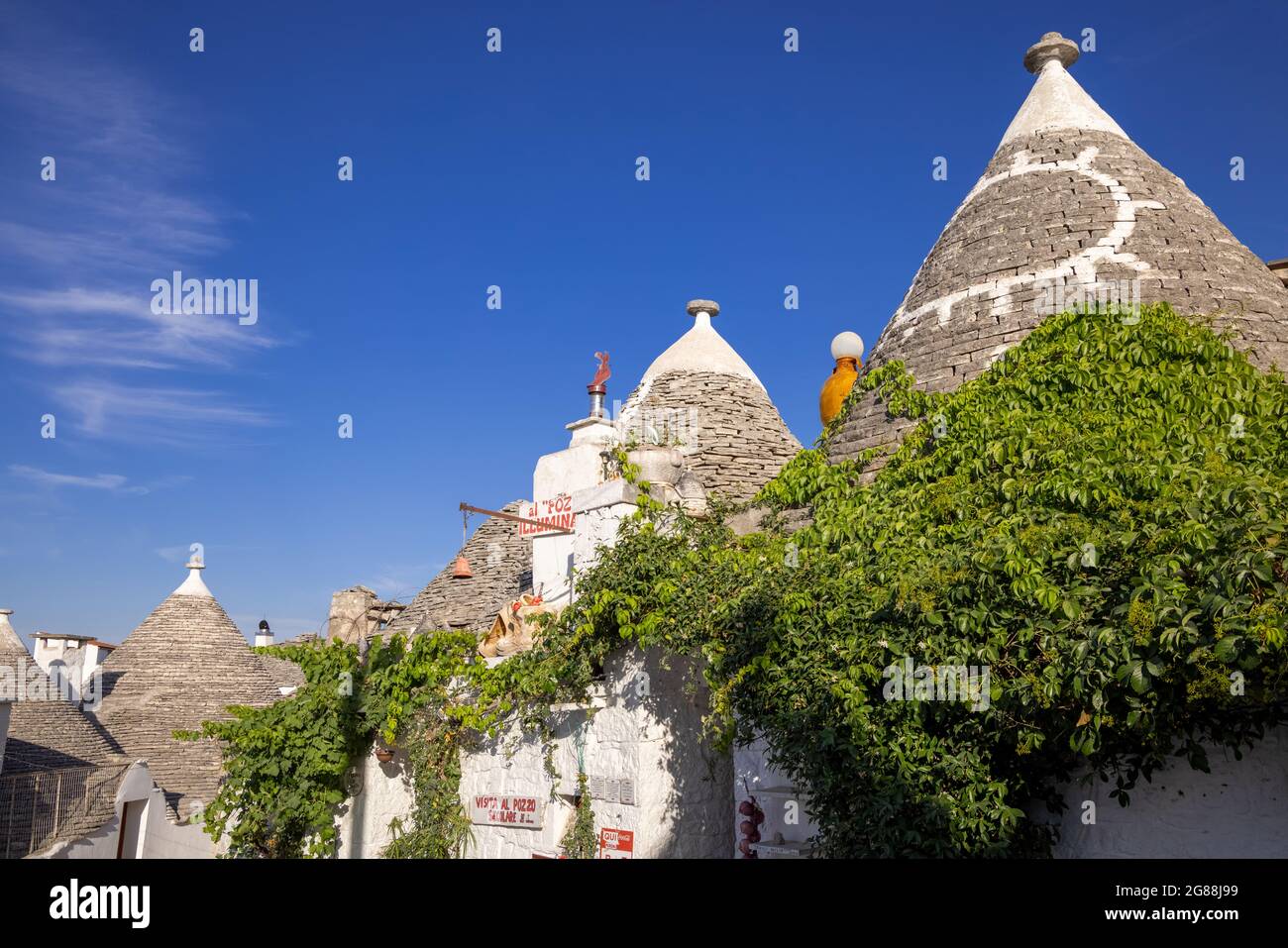 Beautiful town of Alberobello with typical trulli houses built from ...