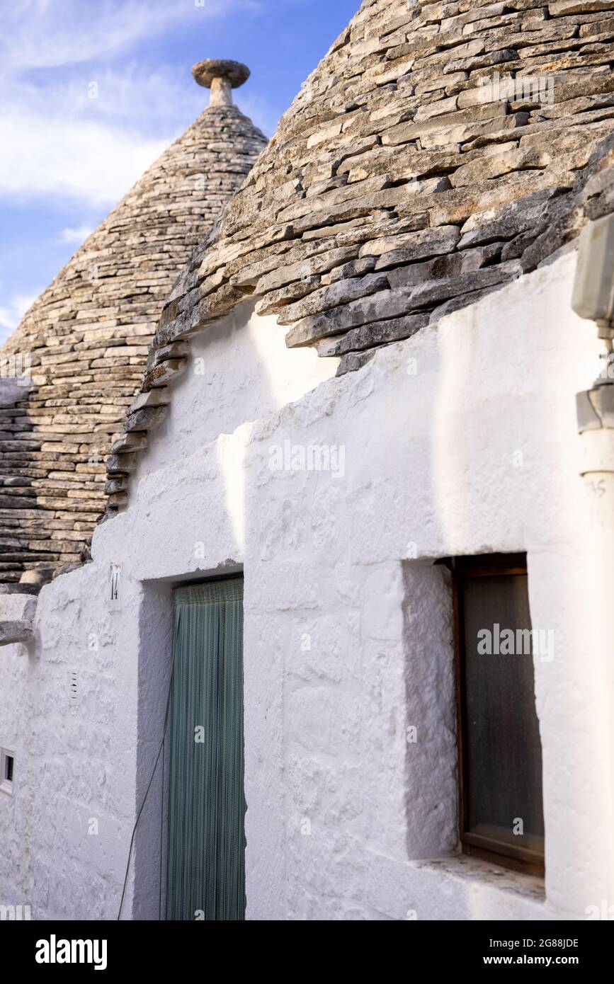 Beautiful town of Alberobello with typical trulli houses built from ...