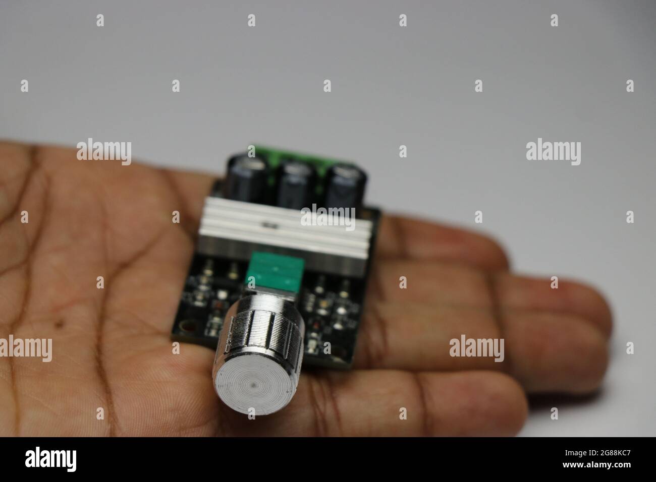 Hand holding pulse width modulation speed controller board module for ...