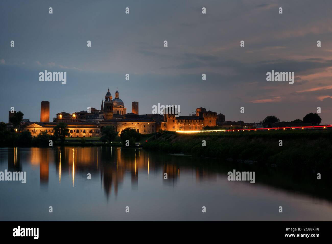 The Mantua (Mantova) skyline at dusk. Beautiful Italian city reflecting ...