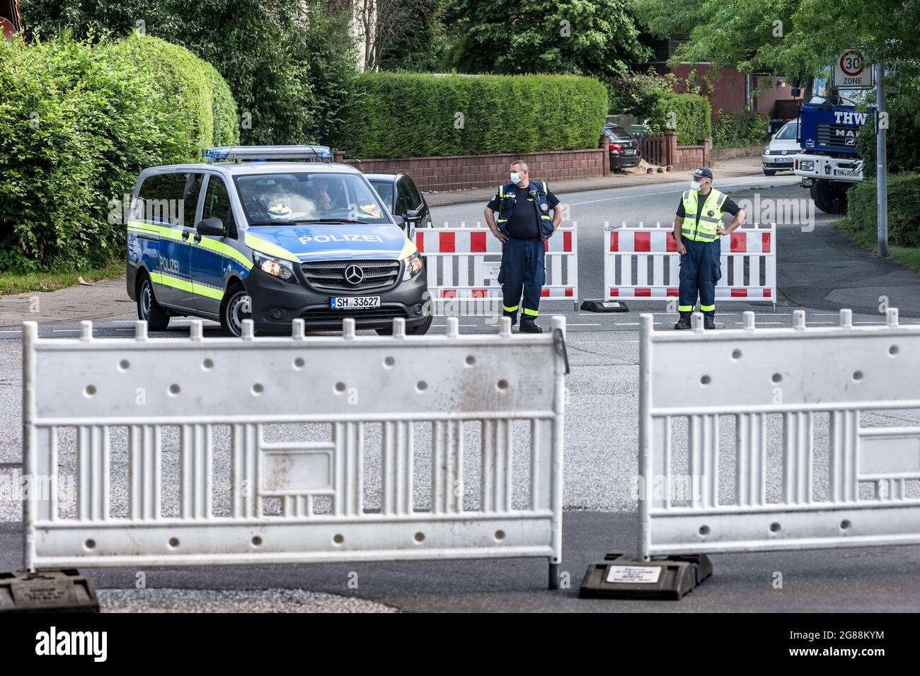 Bad Oldesloe, Germany. 18th July, 2021. Police officers and THW workers ...