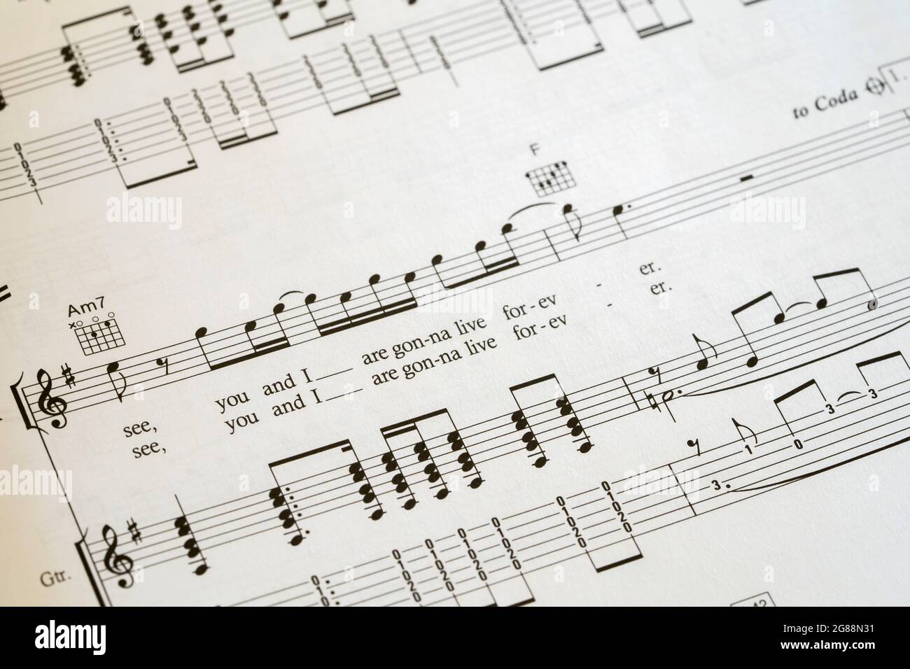 A guitar tab / tablature book showing the lyrics and written music ...