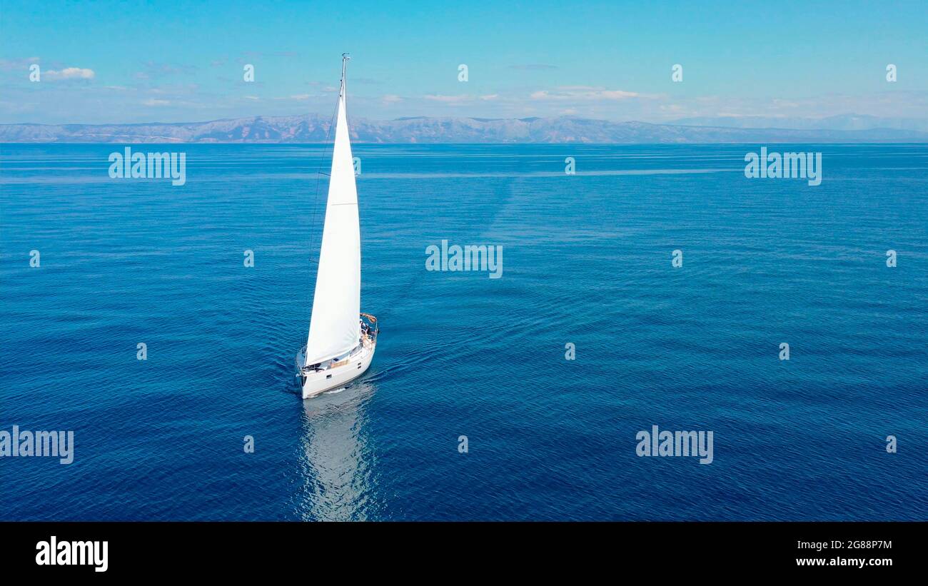 Aerial view of sailing luxury yacht at opened sea at sunny day in ...