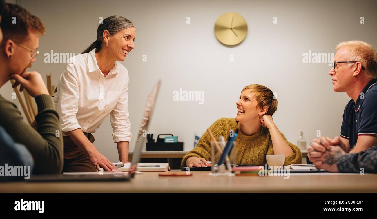 business partners in board room meeting. Female manager briefing ...