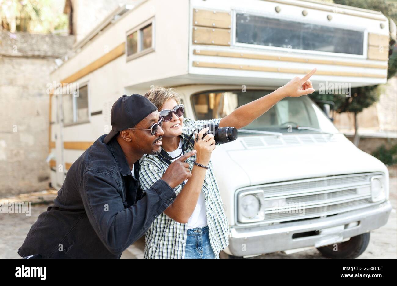 Multicultural african and latin couple enjoing traveling together ...