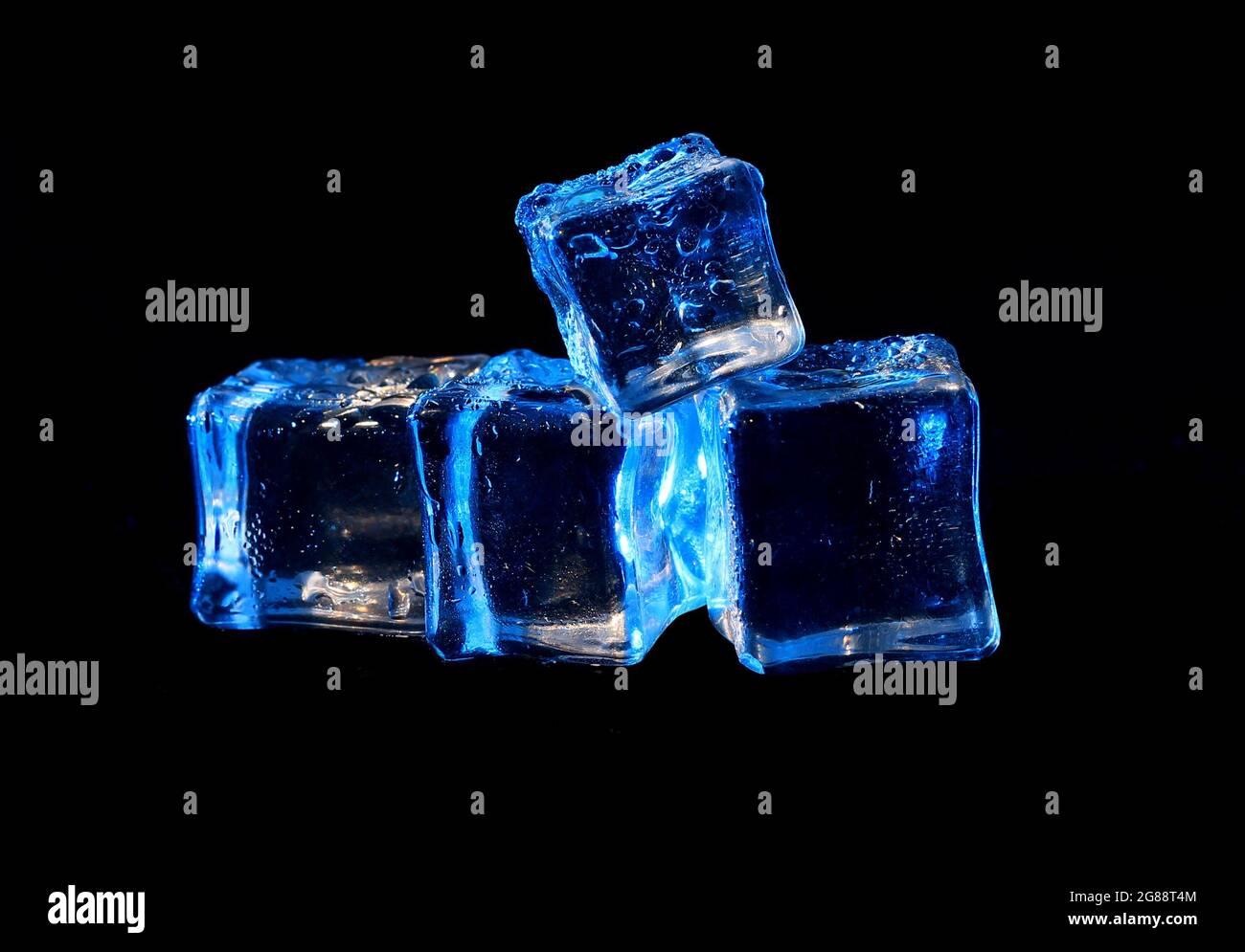 Photo of 5 wet artificial or Blue fake ice cube at Black background ...
