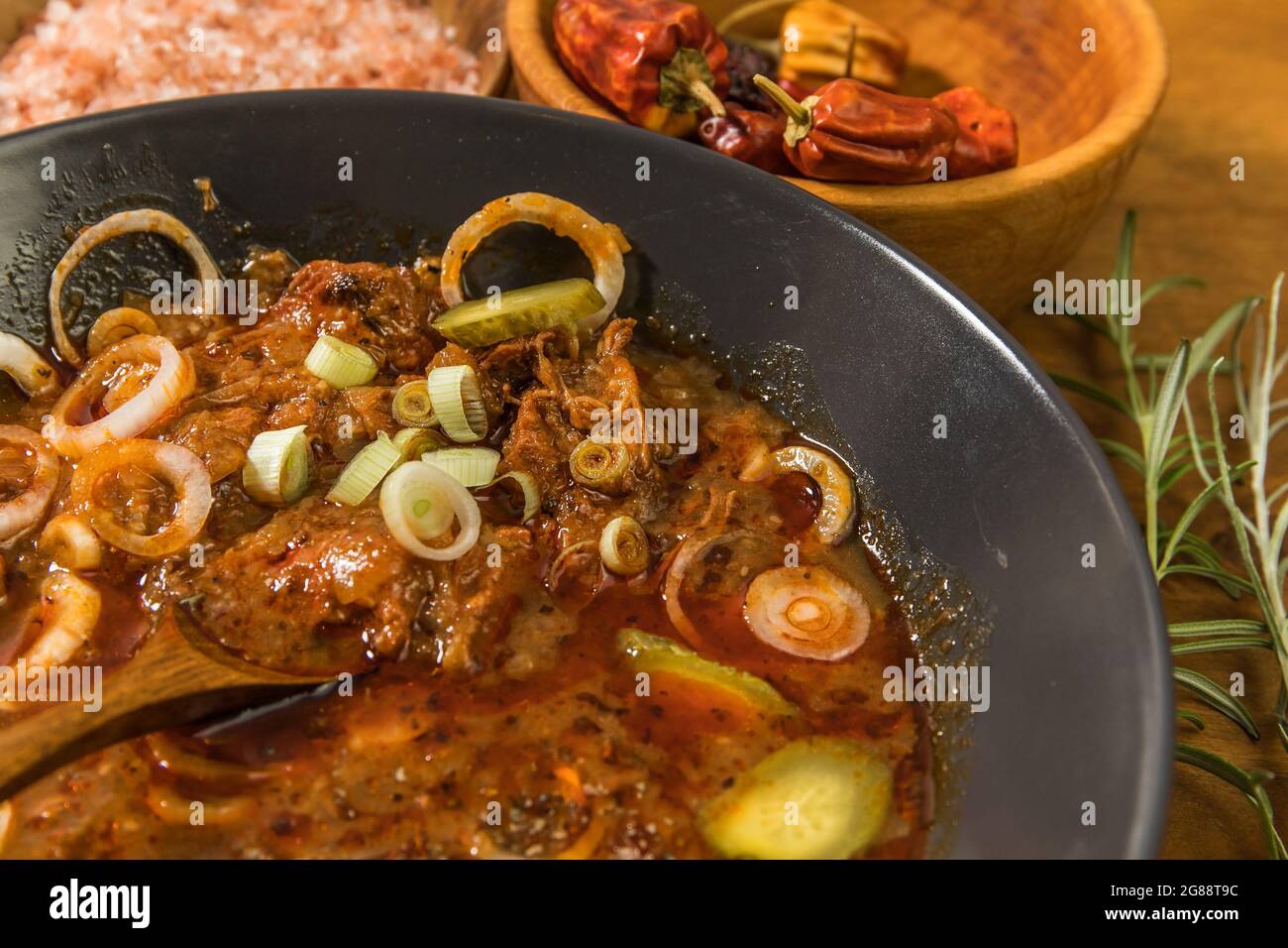 Traditional Hungarian beef stew stew. Goulash with onion and garlic ...