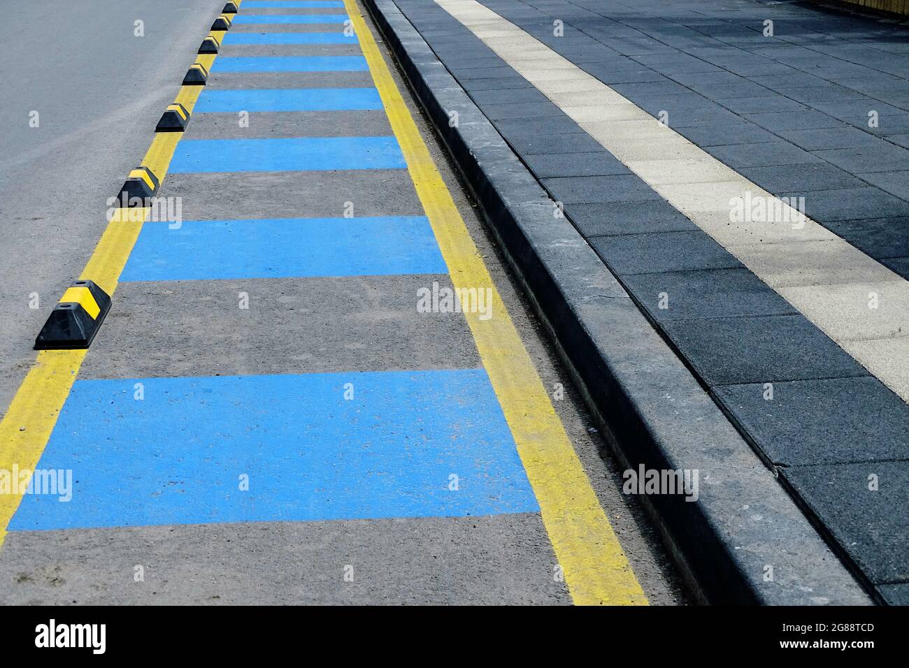 Blue road markings for pedestrian crossing Stock Photo - Alamy