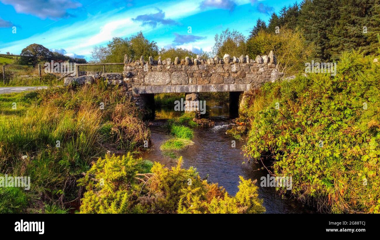 Ancient granite stone bridge across the Walla Brook, near Postbridge ...