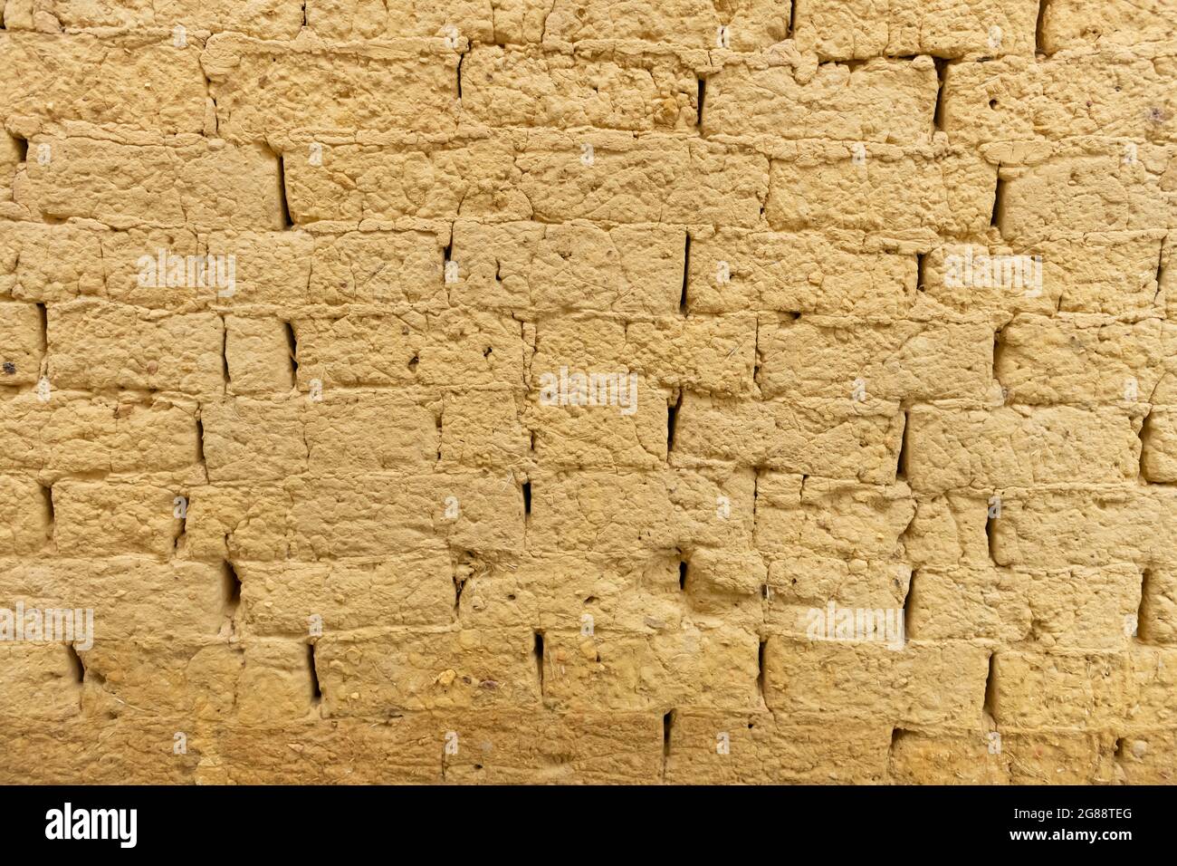 wall made of mud bricks as background and texture Stock Photo - Alamy