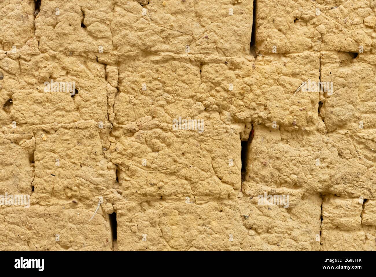 wall made of mud bricks as background and texture Stock Photo - Alamy