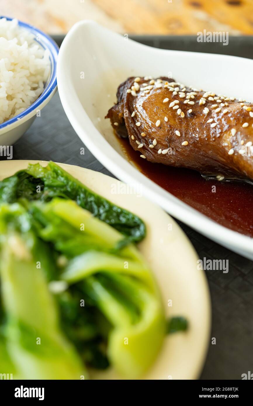 angle view fast food of chicken leg with vegetable and rice vertical ...