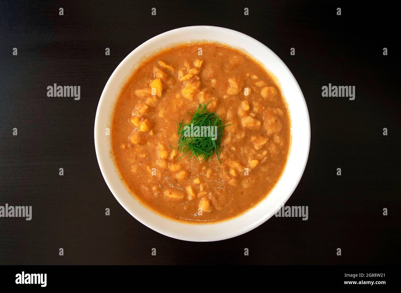 Arabic cuisine - plain peeled fava beans in a brown bowl on a dark ...