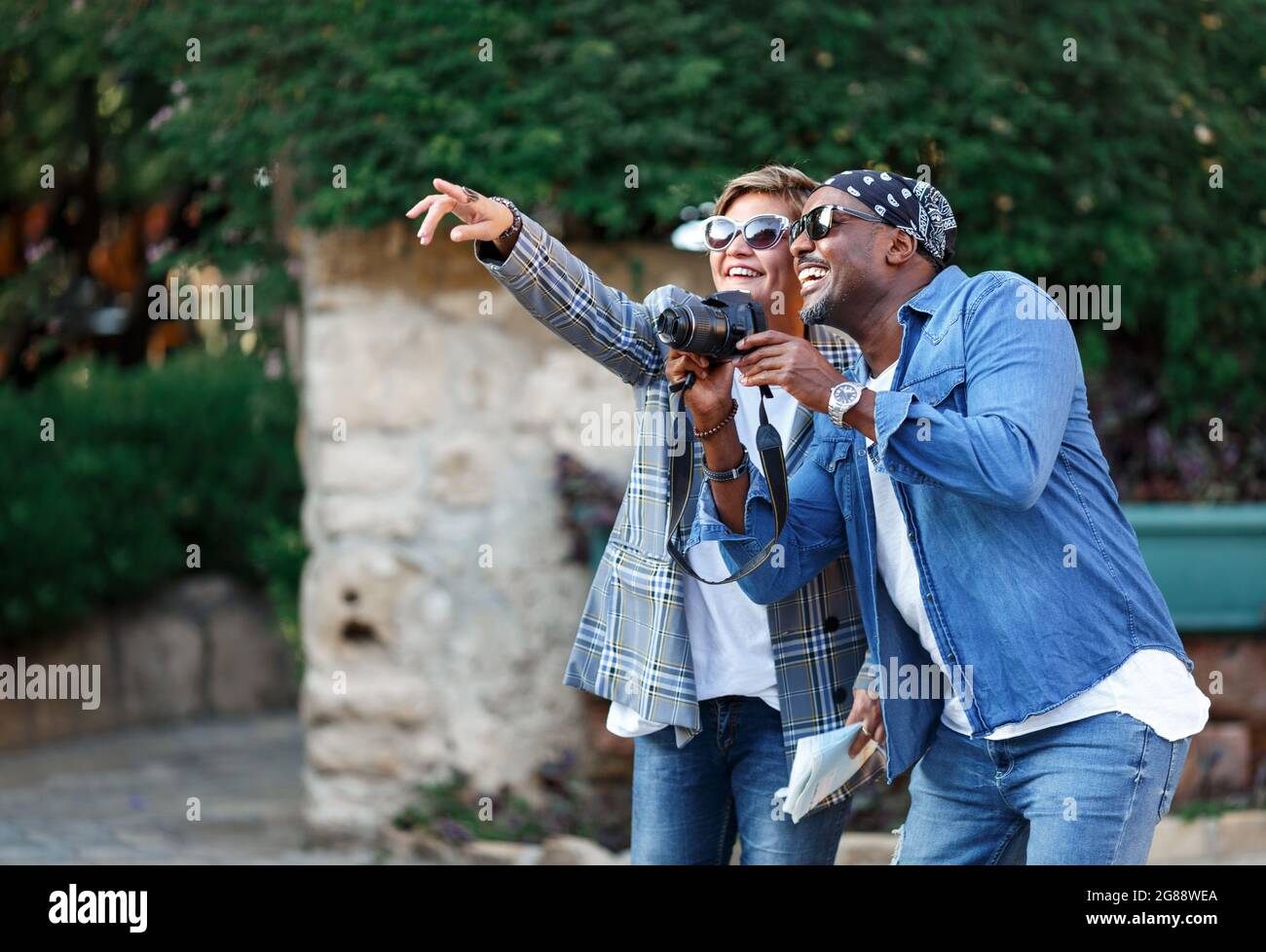 Happy Moments. Cheerful dark skin couple Taking shoot On camera While ...