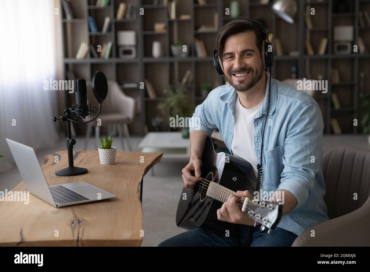 Portrait of happy millennial handsome male musician Stock Photo - Alamy