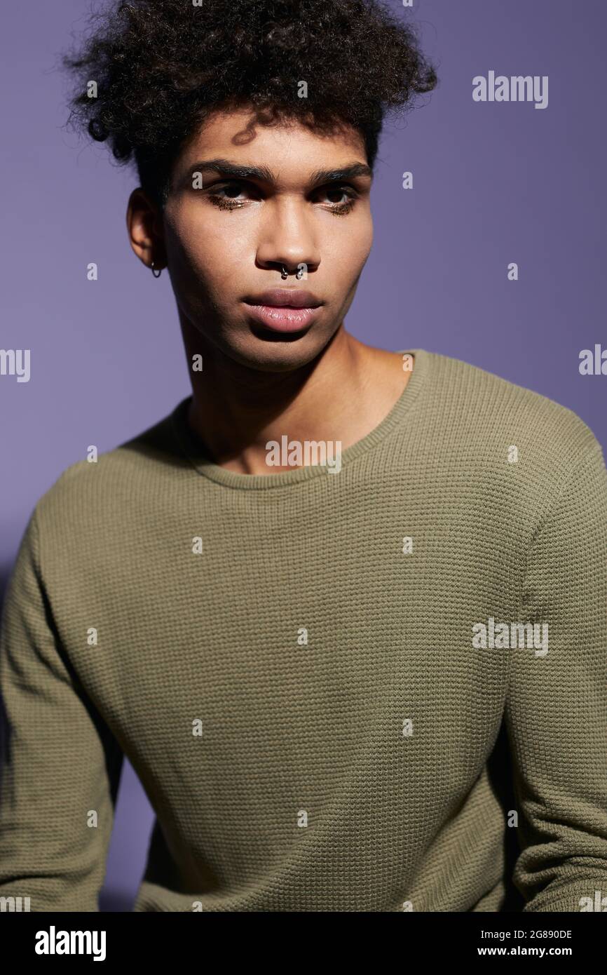 Close up portrait of brunette african american transgender male with ...