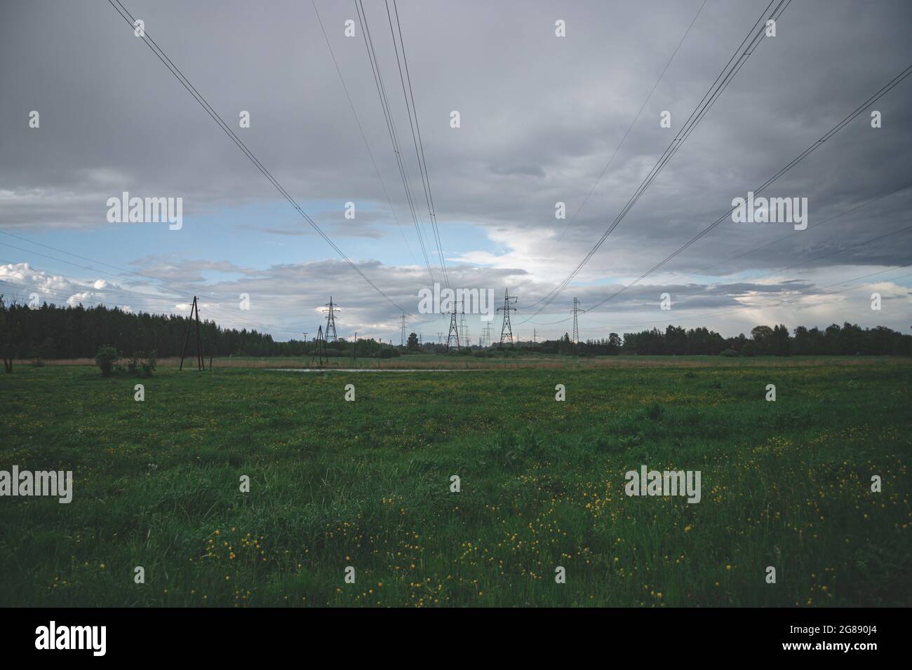 Electric power transmission lines at sky background, an autumn field ...