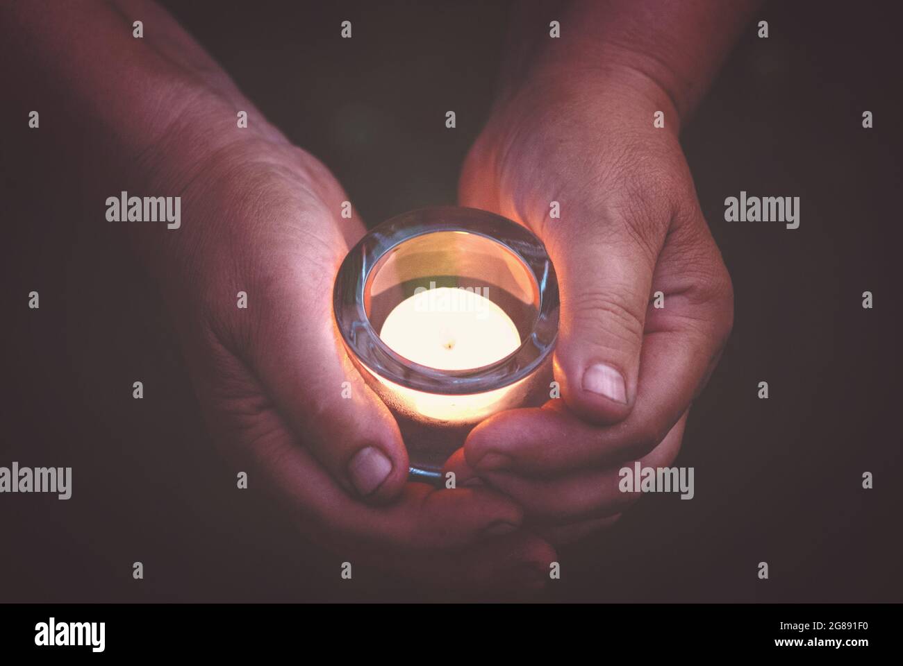 Old senior holding candle hi-res stock photography and images - Alamy