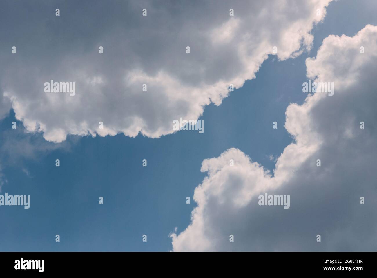 cumulus clouds and sky clearing high up above Stock Photo - Alamy