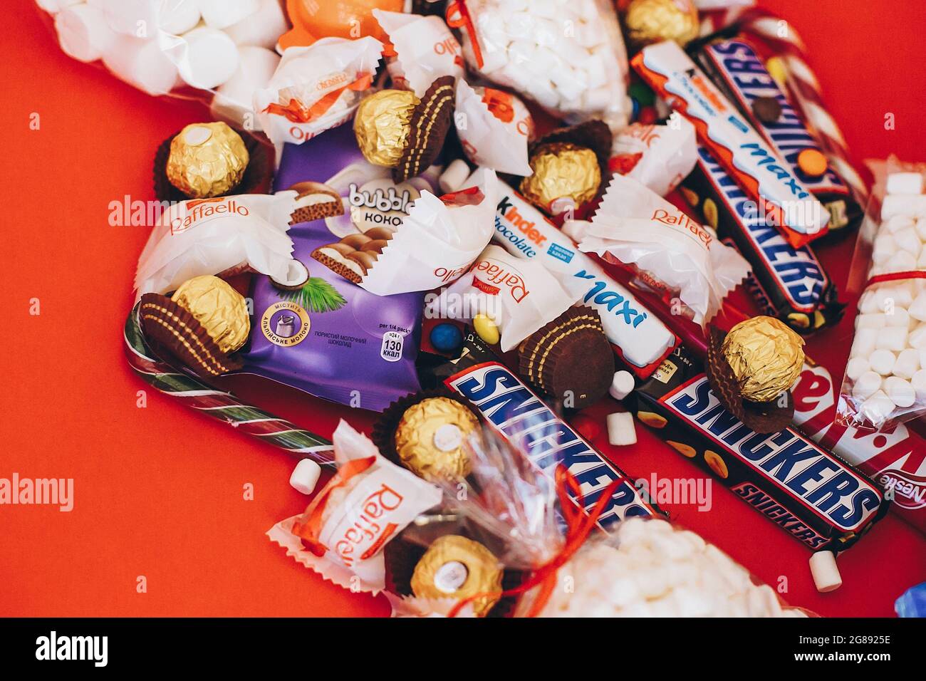 Lviv, Ukraine - December 1, 2017: Many sweets and candy bars on red ...