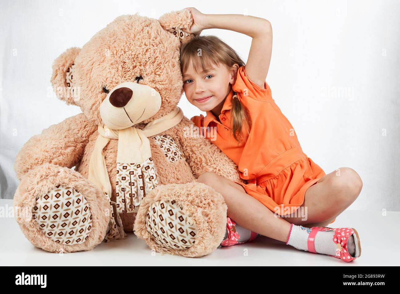Cute Baby Girl Hugging Teddy Bear