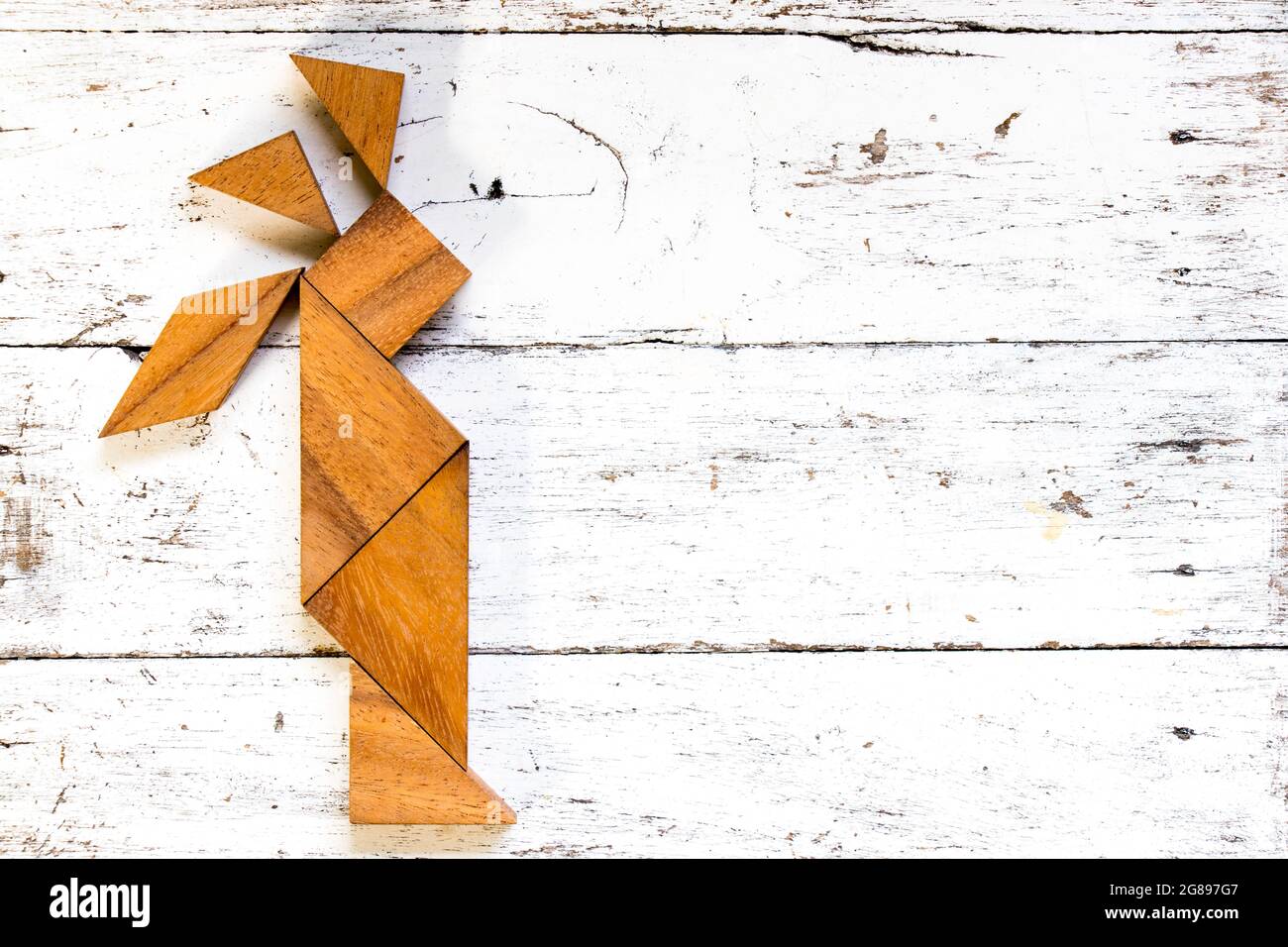 Tangram puzzle in native american indian shape on old white wood ...